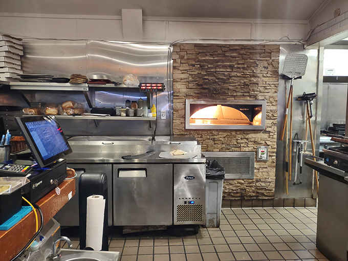 Where the magic happens! The stone-faced pizza oven adds unexpected character to a kitchen that knows its way around seafood.