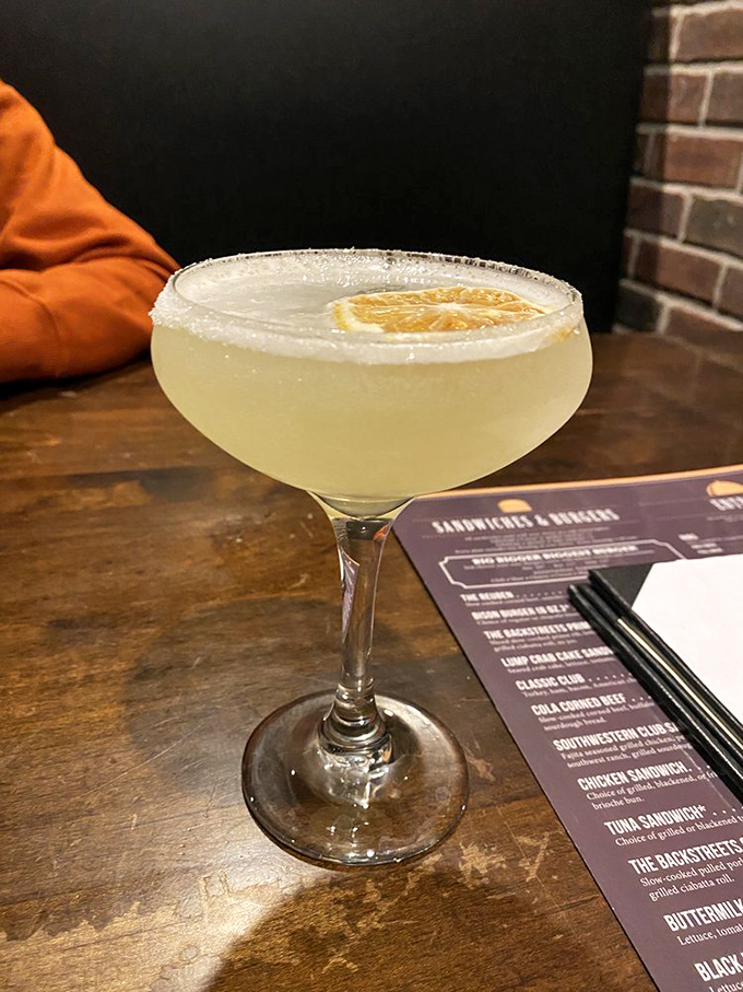 This lemon sage drop cocktail isn't just a drink, it's a vacation in a sugar-rimmed glass with a slice of sunshine on top.