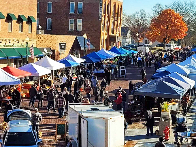 Market day transforms brick streets into a bustling community gathering. Nothing brings neighbors together quite like local vendors and handmade treasures.