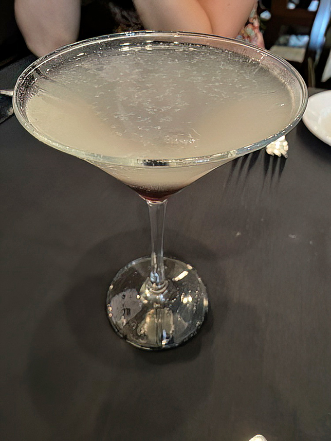 This martini isn't just a drink; it's a sophisticated companion for your evening, dressed in its frosty best and ready for meaningful conversation.