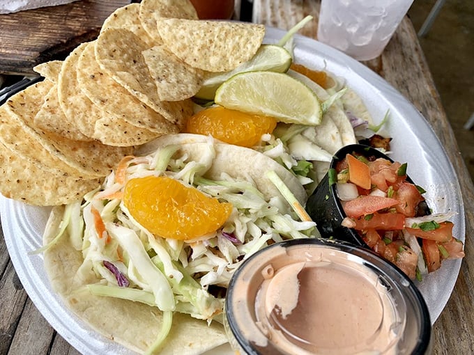 Mahi tacos topped with mandarin oranges&mdash;a tropical twist that somehow makes perfect sense when you're dining with mangroves as your backdrop.