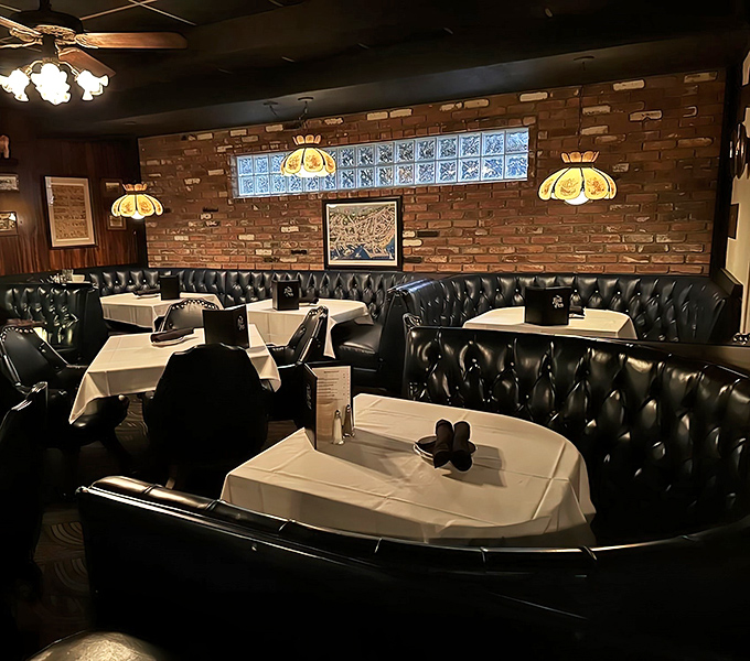 Black leather booths, brick walls, and white tablecloths &ndash; the holy trinity of classic steakhouse ambiance that never goes out of style.