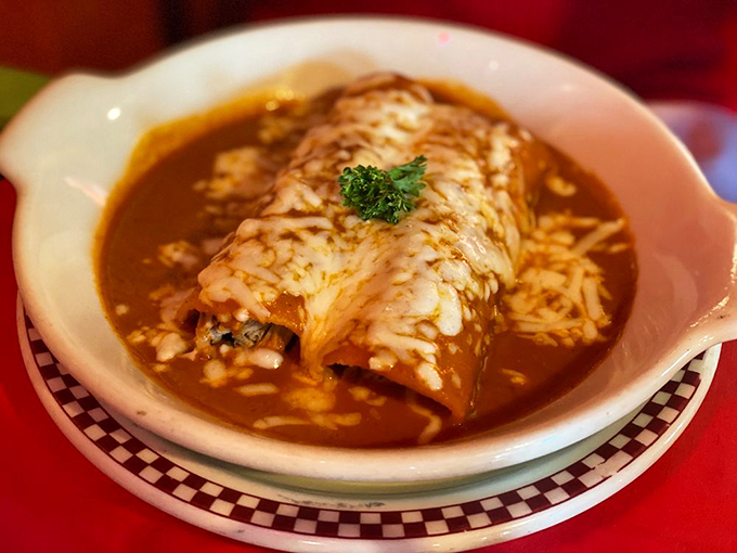 This enchilada doesn't just sit on the plate&mdash;it commands attention with its crown of melted cheese and a sauce that's been perfected over generations.