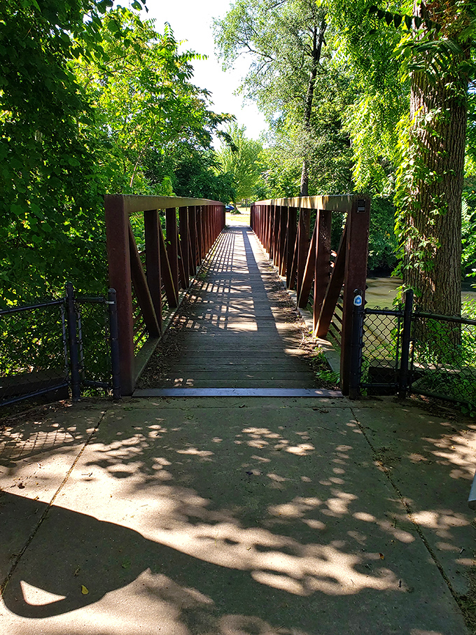 The Riverwalk's wooden bridge invites exploration, promising natural beauty just steps away from downtown's historic charms&mdash;Michigan's version of having your cake and eating it too.