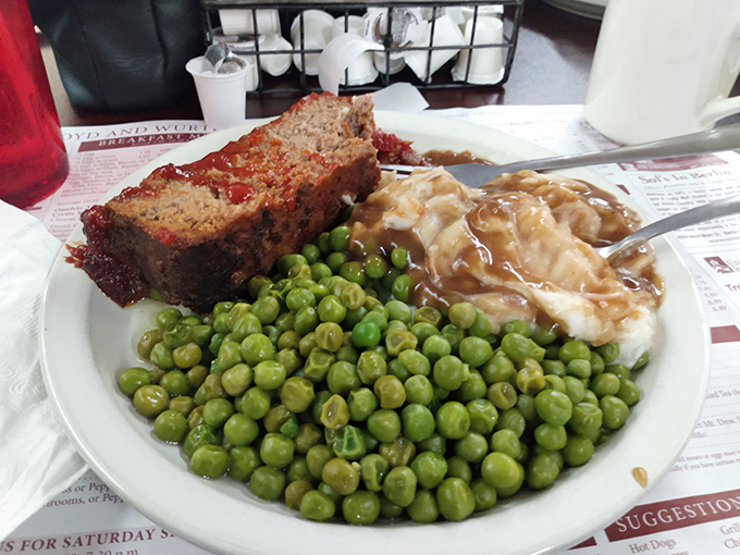 Meatloaf that would make your grandmother both proud and jealous, nestled beside peas that actually taste like vegetables.