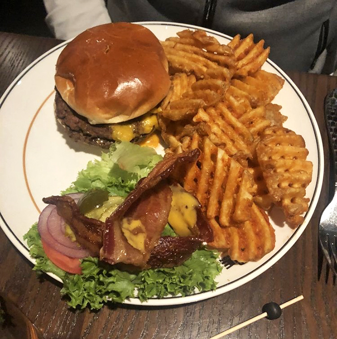 The Monon Burger &ndash; where beef meets destiny on a perfectly toasted bun. Those waffle fries deserve their own fan club and social media following.