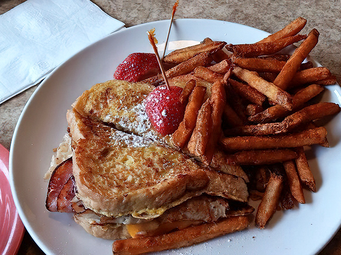 The Monte Cristo: where French toast meets ham and cheese in a powdered sugar paradise. Sweet, savory, and utterly decadent.