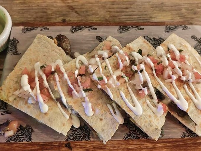 Quesadilla perfection in five triangular pieces. The drizzle of crema and sprinkle of fresh pico elevate this from simple to simply extraordinary.
