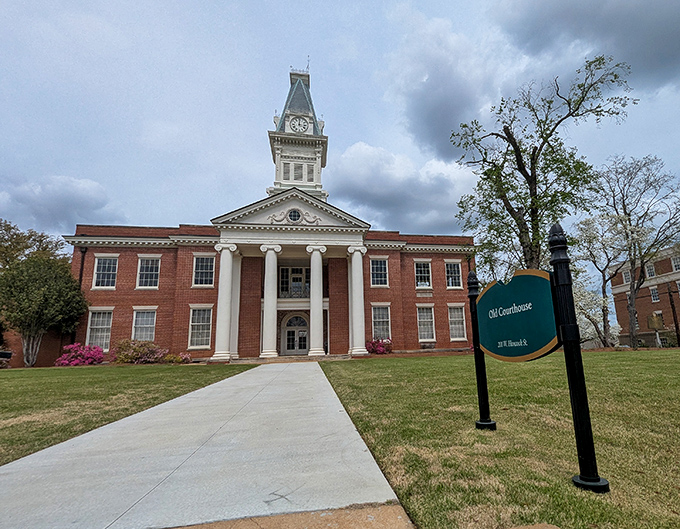 The Old Courthouse stands proud with its clock tower reaching skyward, a timeless reminder that small-town justice comes with architectural flair.