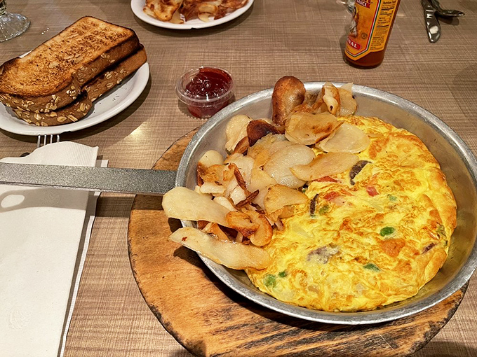 This isn't just an omelet &ndash; it's a skillet-born masterpiece that makes ordinary eggs question their life choices. Hash browns that crisp should be illegal.