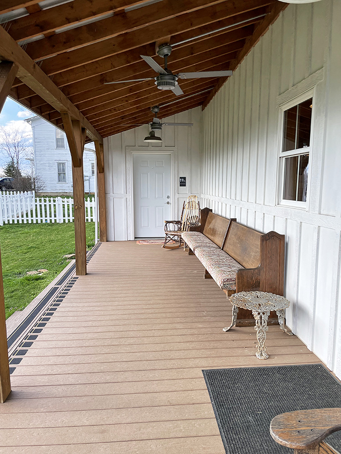This porch was made for sipping. The vintage bench invites you to slow down, breathe deep, and remember what matters&mdash;like that wine slushie in your hand.