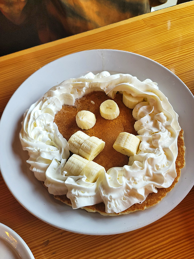 Pancake perfection crowned with fresh bananas and whipped cream that doesn't come from a can. Morning glory on a plate.