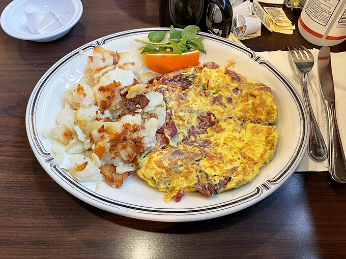 This isn't just breakfast&mdash;it's a pastrami-packed power move to start your day. Crispy potatoes alongside an omelet that means serious business.