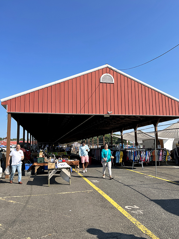 The iconic red pavilion shelters vendors from sun and rain. Like a rustic cathedral dedicated to the holy trinity of haggling, hunting, and handshakes.