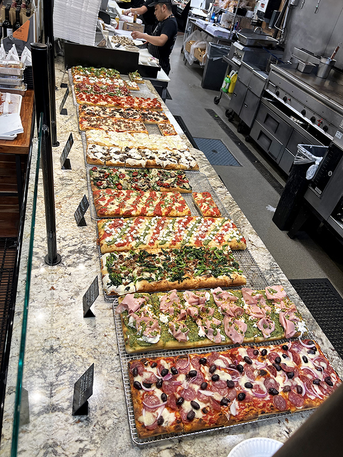 Pizza paradise stretches as far as the eye can see, each rectangular canvas showcasing the infinite possibilities when dough meets imagination.