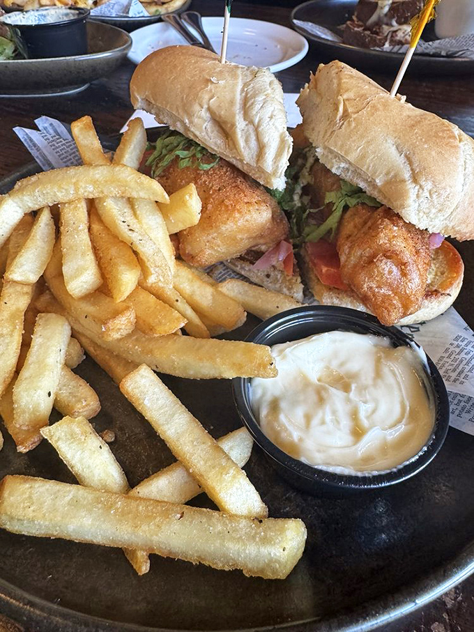 This sandwich isn't just lunch&mdash;it's an architectural achievement of crispy fish, fresh toppings, and pillowy bread that deserves its own blueprint.