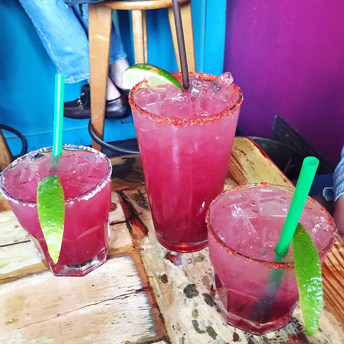 These aren't just margaritas—they're liquid jewels with chili salt rims that make your ordinary happy hour drinks look like amateurs.