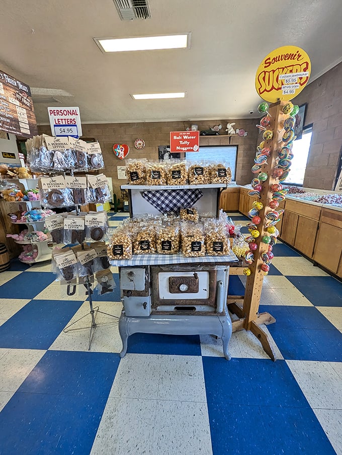 The vintage stove display showcases popcorn and taffy, proving that old-fashioned equipment makes treats taste better &ndash; it's science, don't question it.