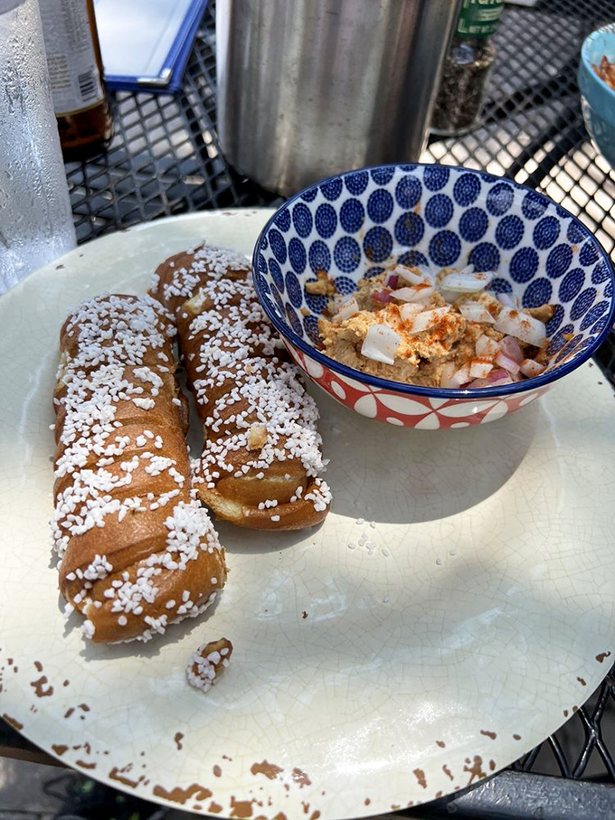 Pretzel sticks with pearl sugar that sparkle like edible jewelry. The colorful bowl of accompaniments proves someone in the kitchen cares about the details. 