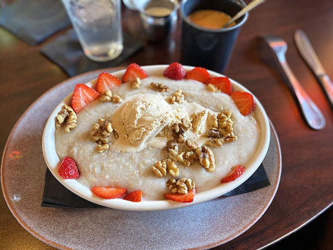 Not just oatmeal, but a canvas of comfort&mdash;crowned with fresh strawberries, walnuts, and a scoop of ice cream melting into warm porridge.