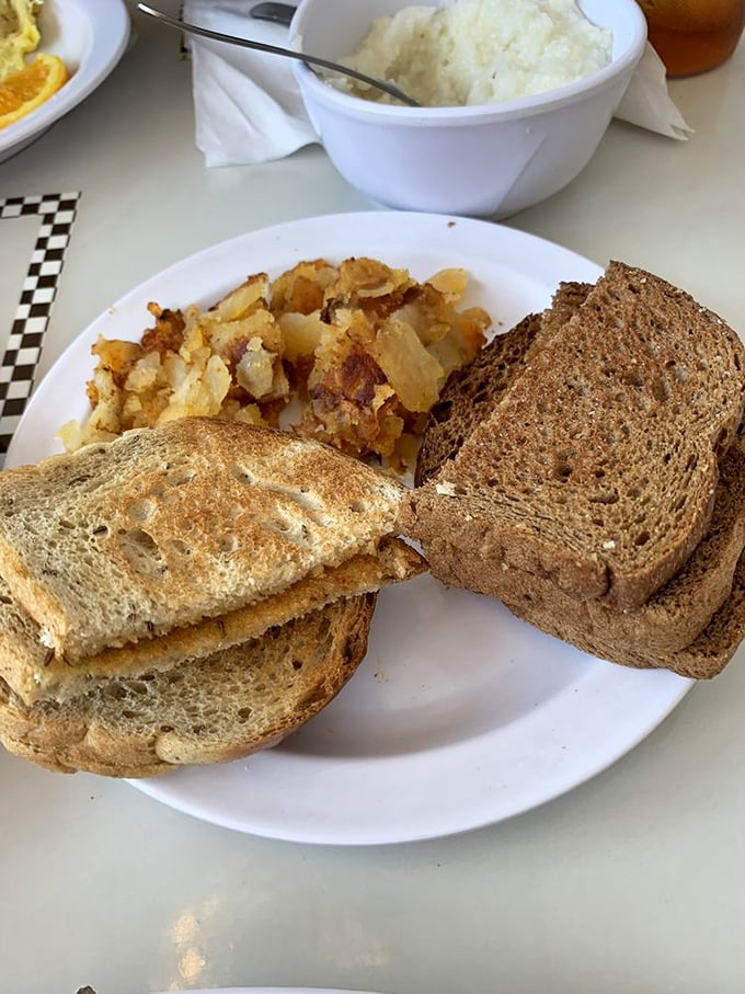 Toast&mdash;the unsung hero of breakfast, perfectly browned and ready to support whatever egg masterpiece you've ordered.