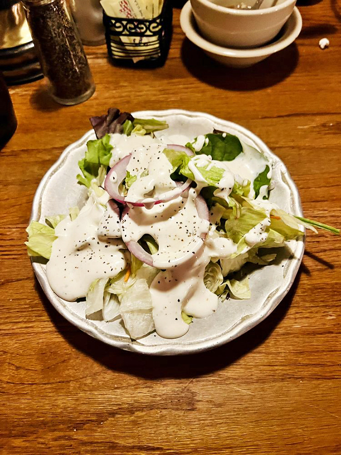 A simple house salad that knows its role &ndash; the opening act that refreshes the palate without stealing the show from the steaks.