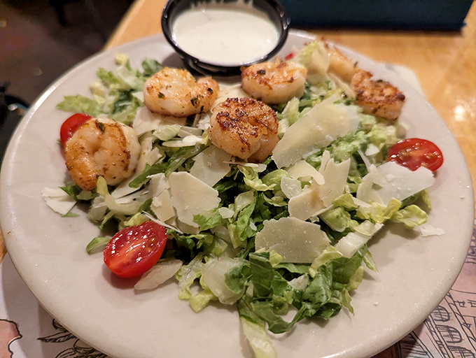 A Caesar salad that actually remembers vegetables are supposed to be fresh, with grilled shrimp that didn't spend its life in the freezer section.