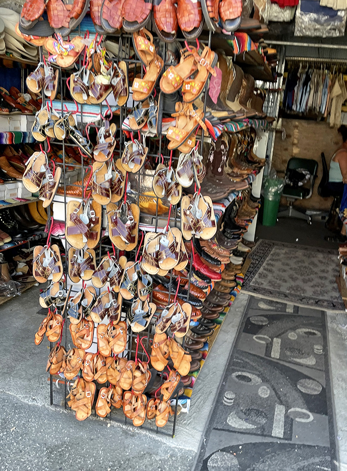 Boot boulevard! These handcrafted leather beauties hang like ripening fruit, waiting for the perfect pair of feet.