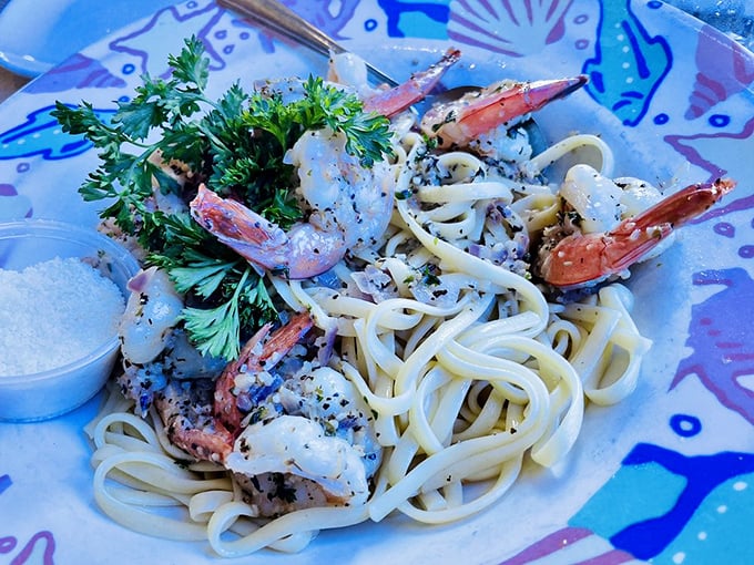 Plump shrimp lounging on a bed of pasta like they're at a seafood spa. The parsley adds a splash of color and freshness.