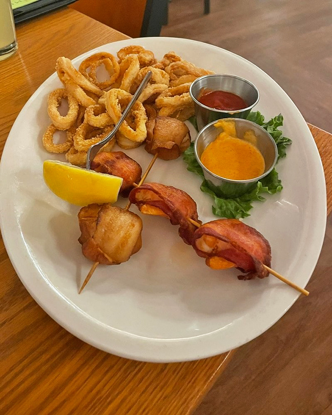 Seafood skewers and crispy calamari share the spotlight with dipping sauces that deserve their own Grammy for best supporting role.