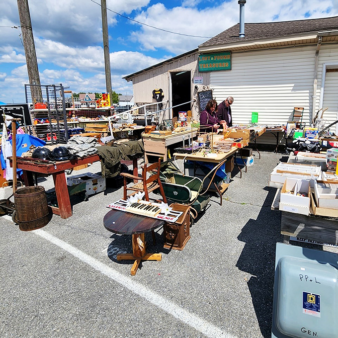 Musical instruments and everyday artifacts create an impromptu still life at this outdoor stall, where that partial piano keyboard hints at melodies from another era.
