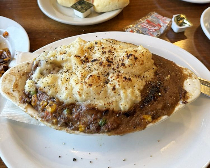 Shepherd's pie that doesn't mess around. That golden potato peak rising from savory depths is comfort food architecture at its finest.