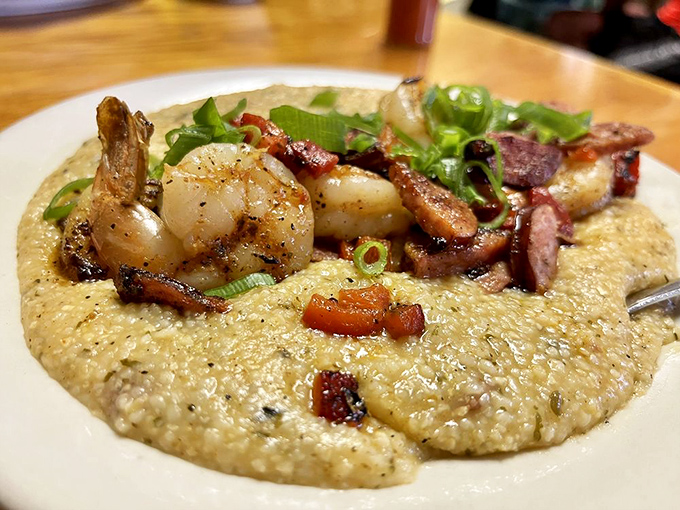 Shrimp and grits elevated to an art form &ndash; plump Gulf shrimp and smoky bacon nestled on creamy grits that would make any Southerner nod in approval.
