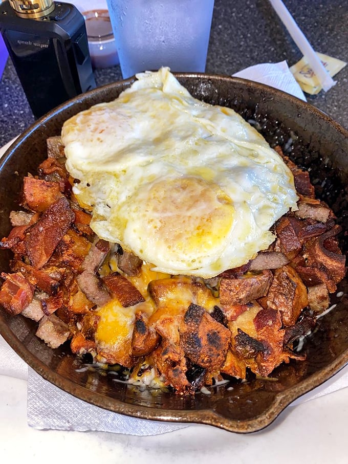 The skillet hash&mdash;where potatoes, meat, and eggs unite under a blanket of melted cheese in a cast iron pan of morning magnificence.