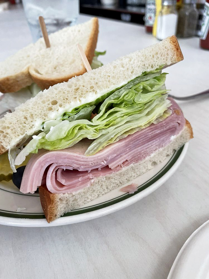 The Southern Baked Ham sandwich &ndash; where thinly sliced ham and crisp lettuce create a masterpiece of simplicity that puts fancy sandwiches to shame.