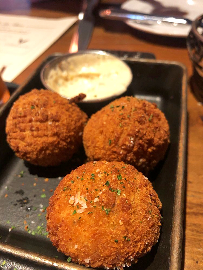 These aren't ordinary appetizers&mdash;they're golden-fried spheres of joy that make sharing nearly impossible. You'll want all three for yourself.