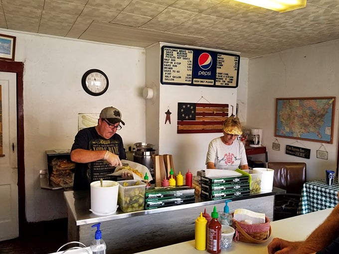 The maestros at work &ndash; their hands moving with the practiced precision that comes only from preparing thousands of hot dogs to perfection.