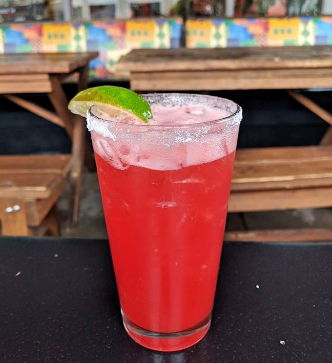 A strawberry margarita so vibrant it could double as a traffic signal. This ruby-red refresher demands to be photographed before sipped.
