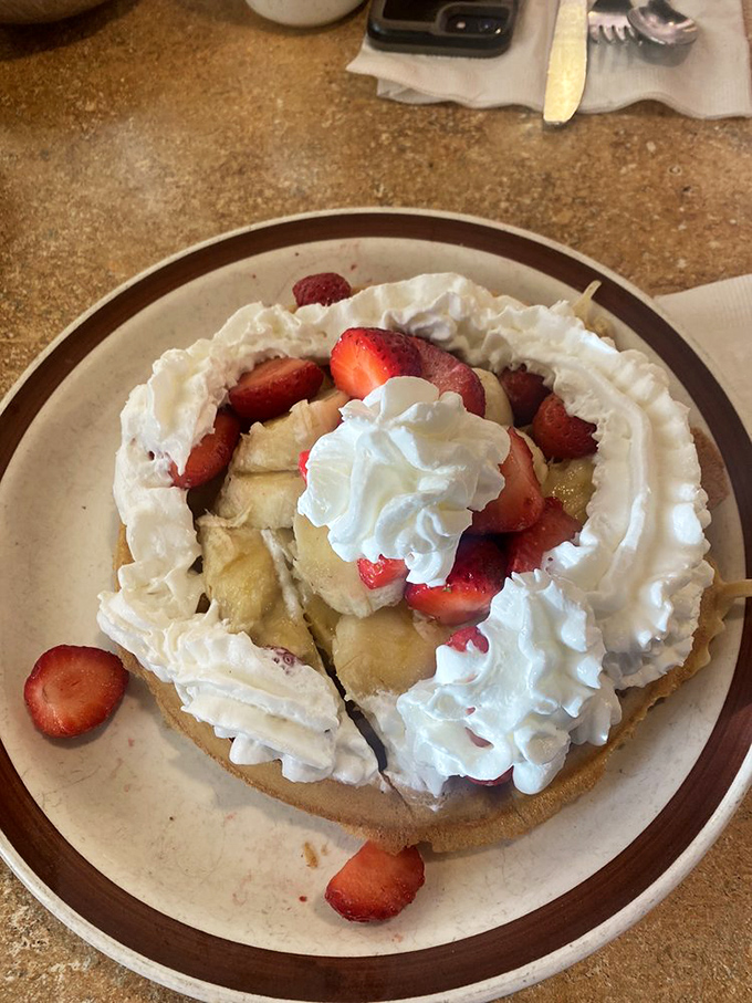 A waffle that's dressed for success with fresh strawberries, bananas and enough whipped cream to make you question your life choices &ndash; in the best possible way.