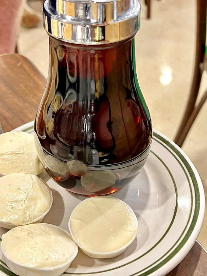 That classic glass syrup dispenser&mdash;the unsung hero of breakfast, ready to transform pancakes from good to transcendent.