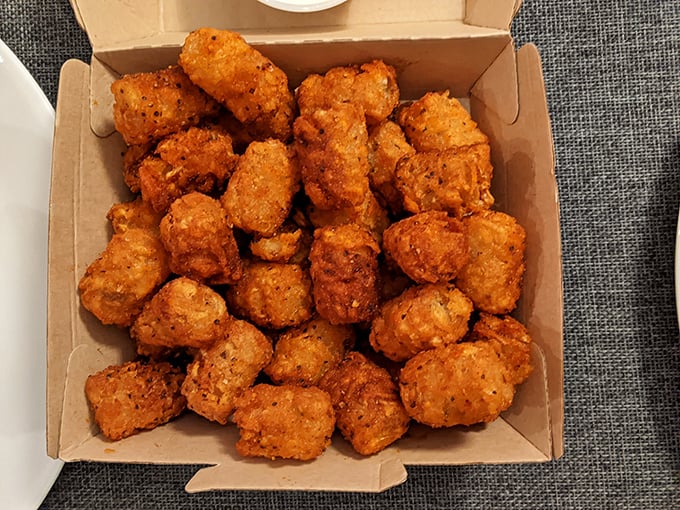 These aren't just tater tots; they're little golden nuggets of nostalgia that somehow taste better than your childhood memories.