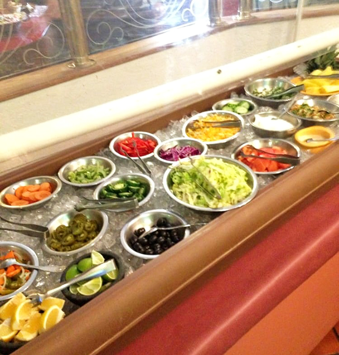 The salsa bar—a colorful playground for grown-ups where every little metal bowl holds the potential to transform your meal from great to unforgettable.