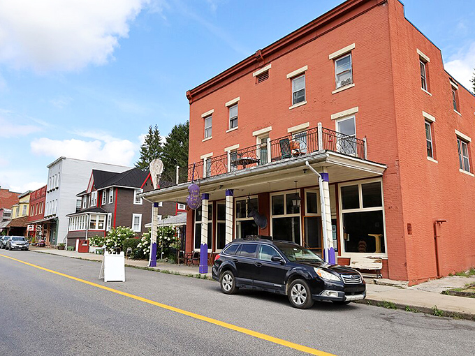 The Purple Fiddle's distinctive purple columns signal the unofficial community center of Thomas, where music and conversation flow as freely as the beer.