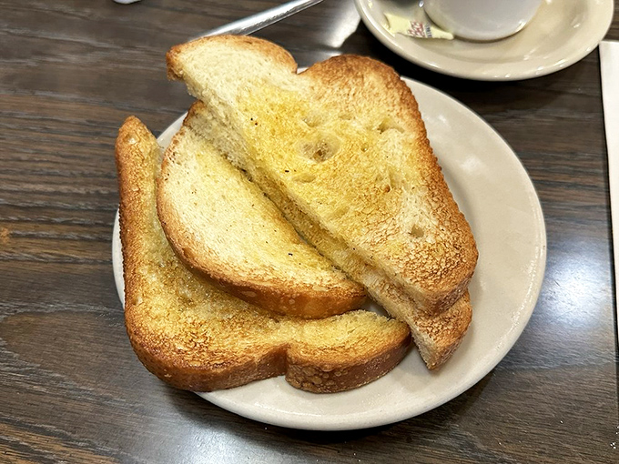 Toast done right &ndash; golden-brown, butter-kissed slices that prove even the simplest items deserve proper attention and respect.