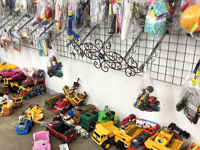 Childhood nostalgia parked on concrete floors. These plastic chariots await new adventures with the next generation of imaginative drivers.