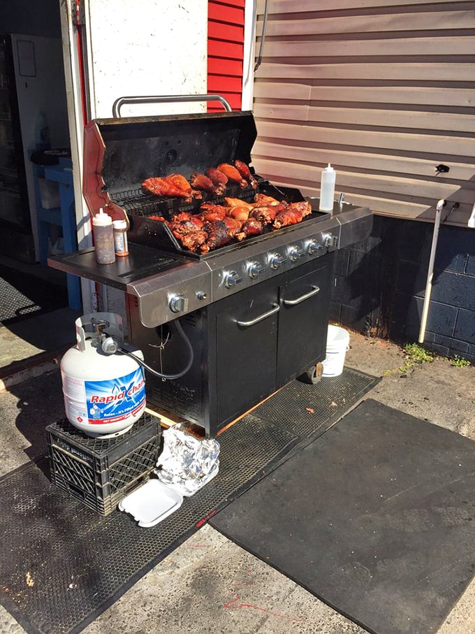 BBQ perfection in progress! These slow-cooking meats aren't just food&mdash;they're aromatic ambassadors converting passing shoppers into hungry customers with each waft of smoky goodness.