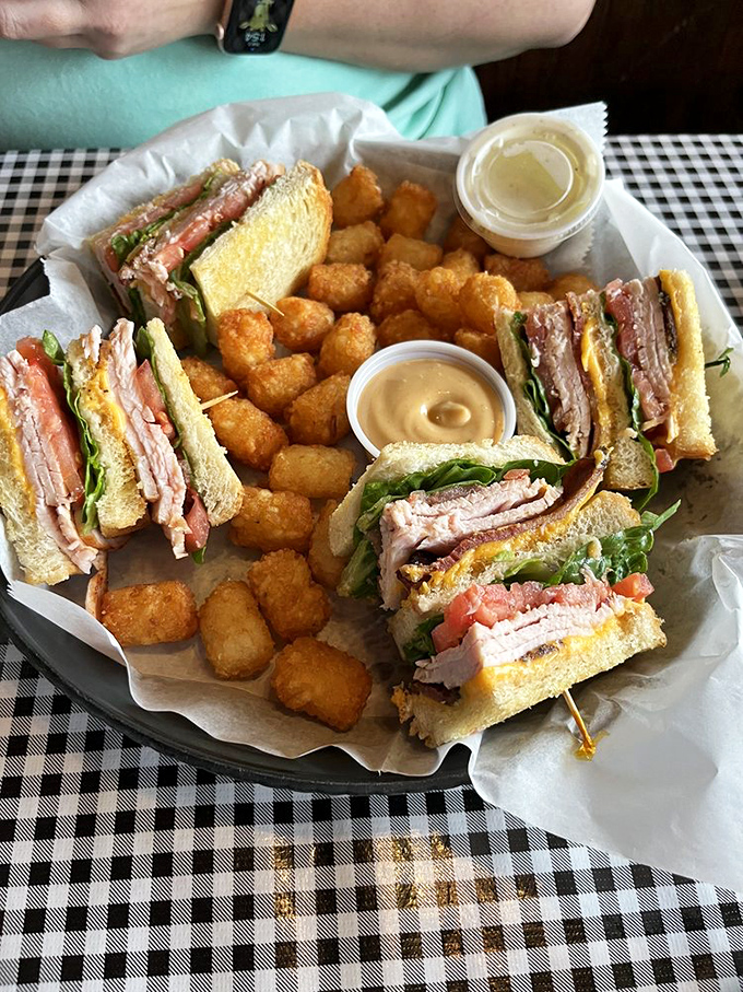 Club sandwiches are the Swiss Army knives of lunch&mdash;reliable, multi-layered, and perfectly paired with golden tater tots that crunch like happiness itself.