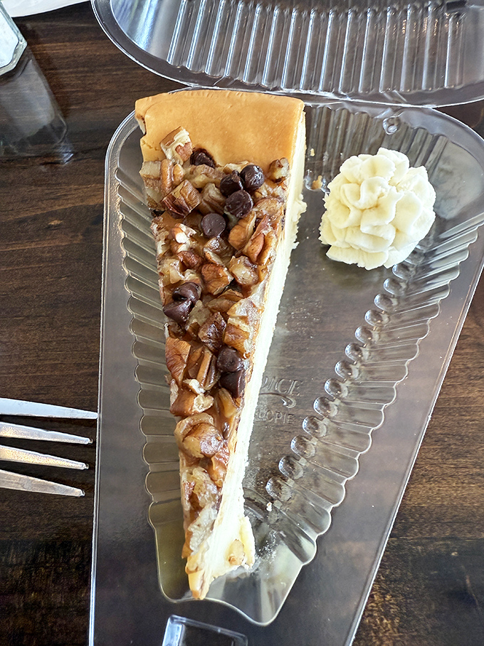 Turtle cheesecake crowned with pecans and chocolate chips&mdash;proof that sometimes more is exactly the right amount. Worth every calorie and then some.