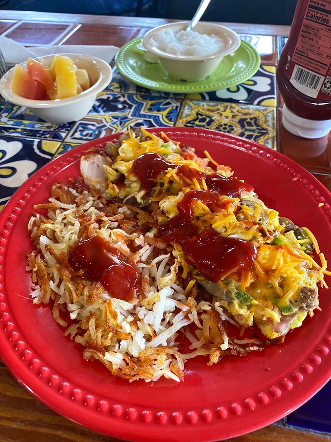 An omelet that's been given the royal treatment, crowned with melted cheese and accompanied by hash browns that achieved the perfect crisp-to-tender ratio.