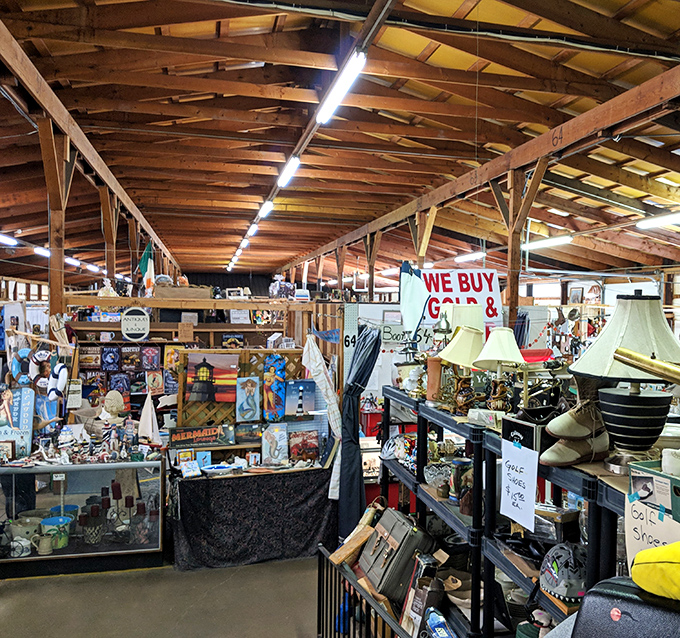 Under exposed wooden beams, vendors arrange their treasures like museum curators, each shelf a carefully considered exhibition.